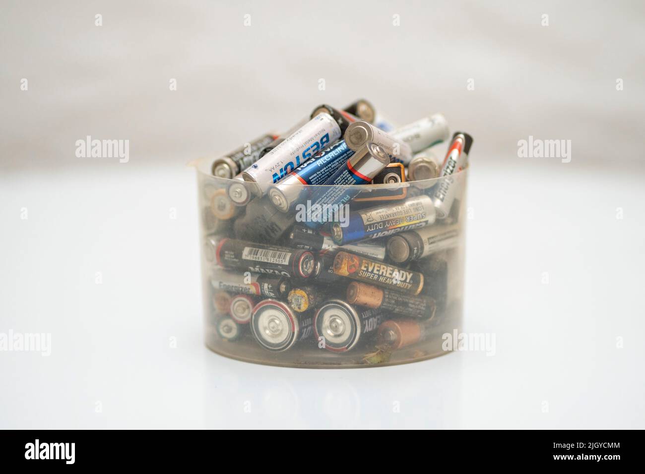 A close-up shot of dead batteries in a plastic container Stock Photo ...
