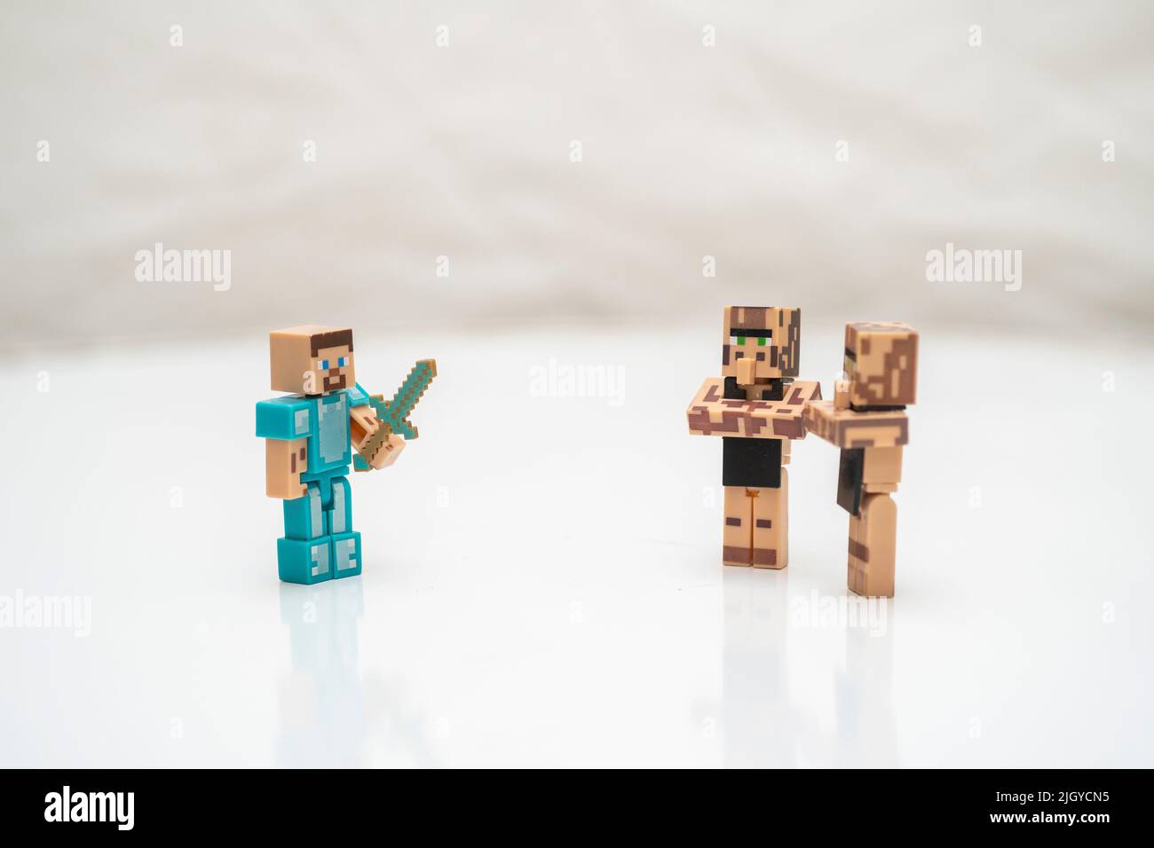 A close-up shot of Minecraft action figures on a white background Stock ...