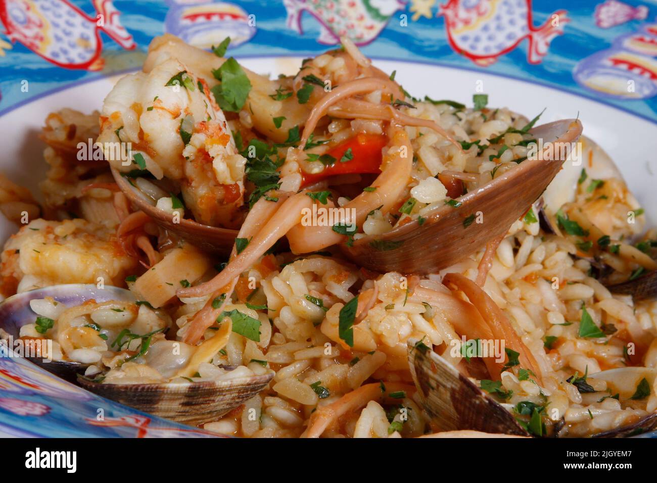 Seafood risotto on the dinner plate Stock Photo - Alamy