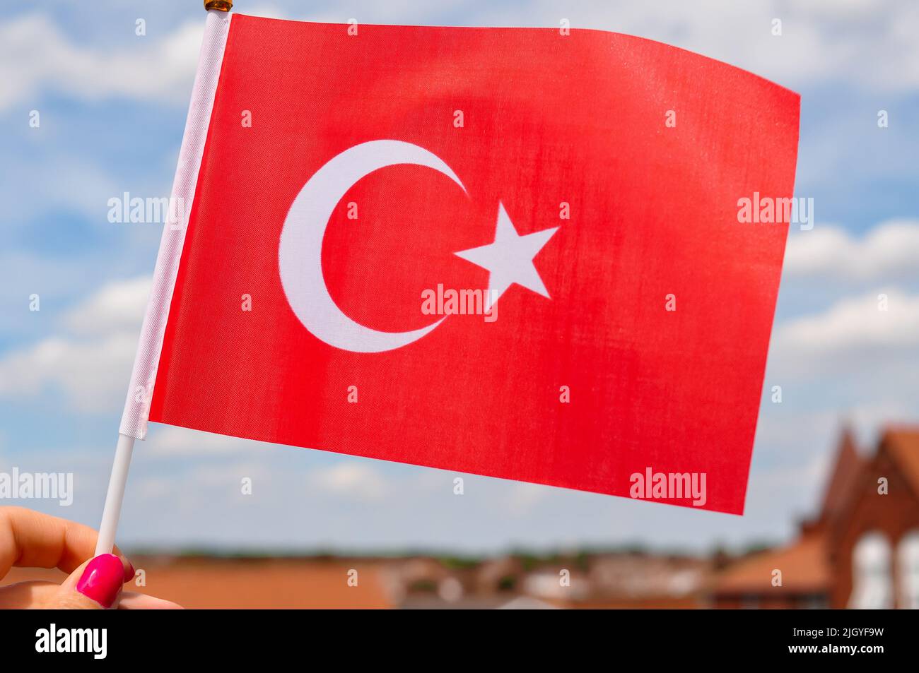 the national red flag of Turkey in hand close up,moon and star Stock ...