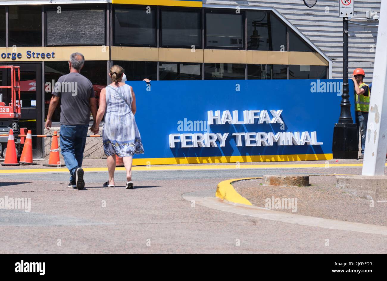 Crew installing new sign at entrance of the Halifax Ferry Terminal ...