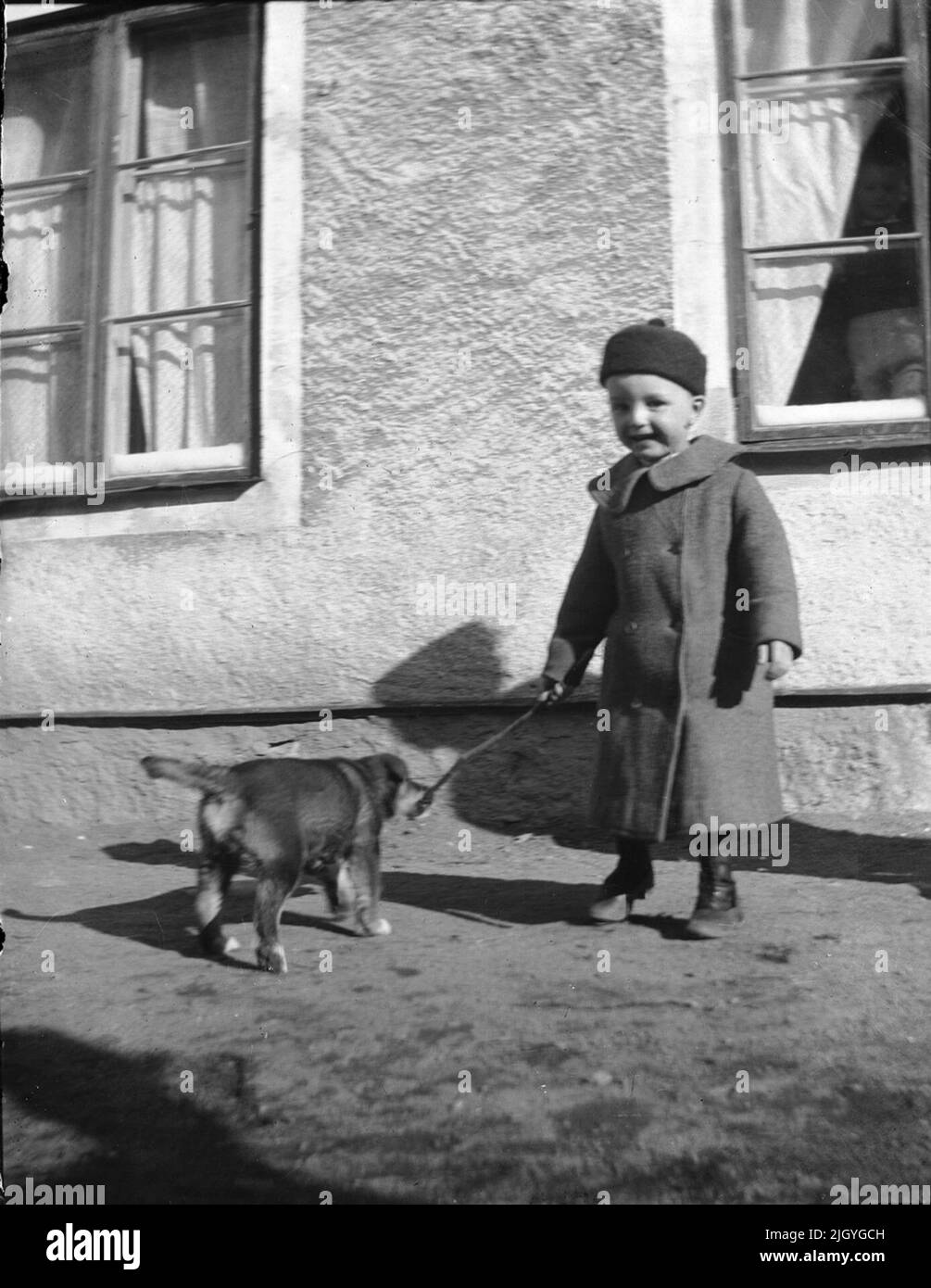 Ivar Liljefors with the dog Finn, Svartbäcksgatan 37, block Edda ...