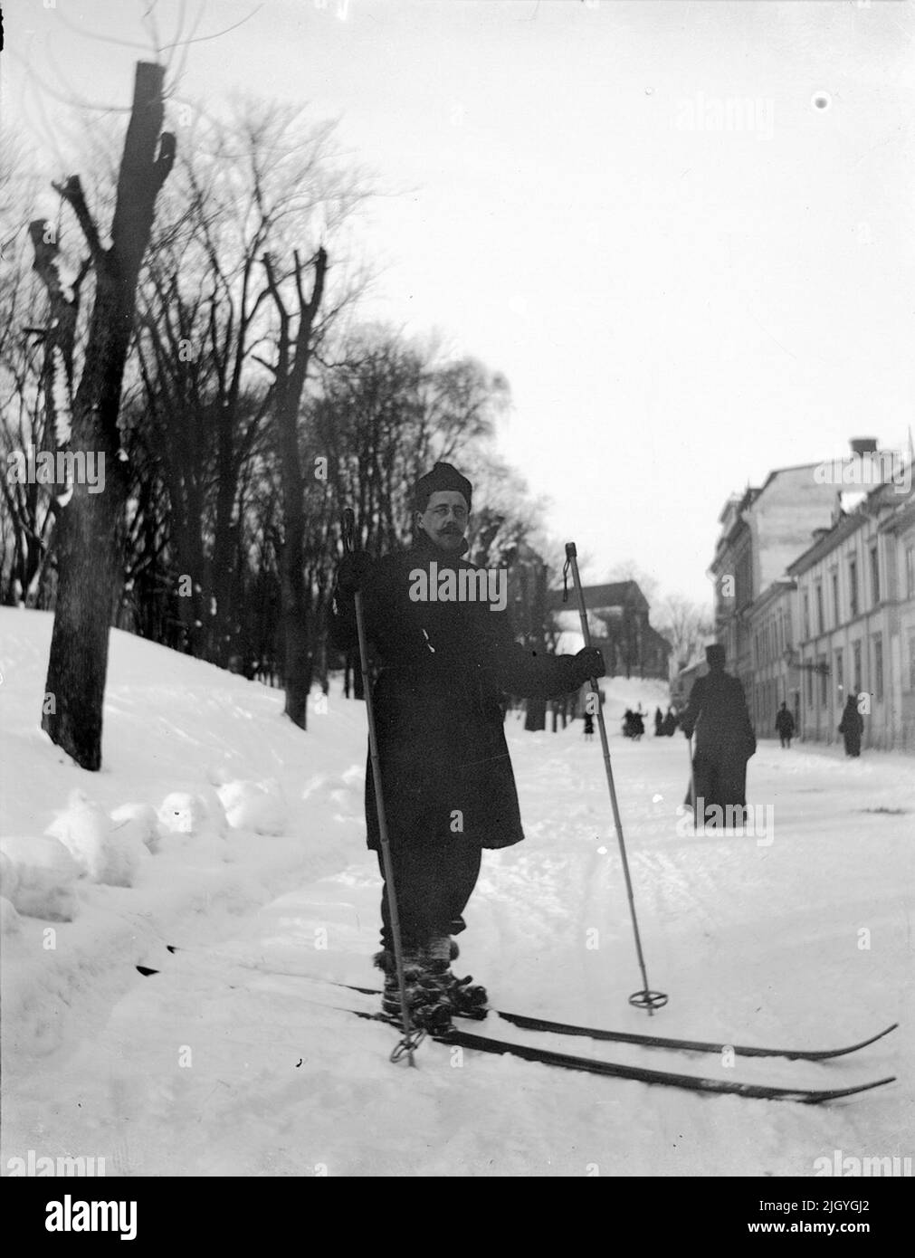 Man on skis, lower castle street, Uppsala. Man on skis, lower castle ...