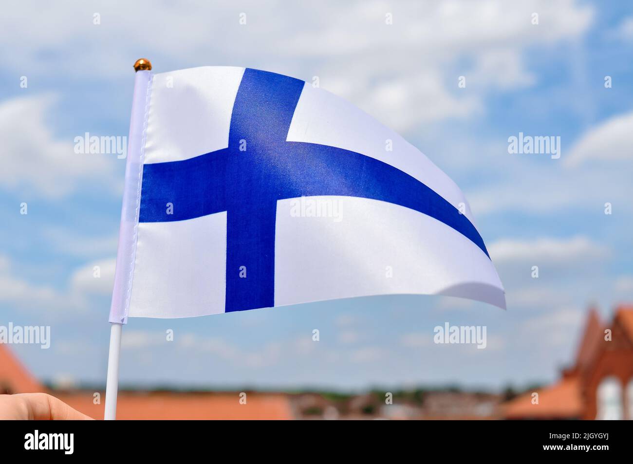 close up of national white flag with blue cross of Finland Stock Photo ...