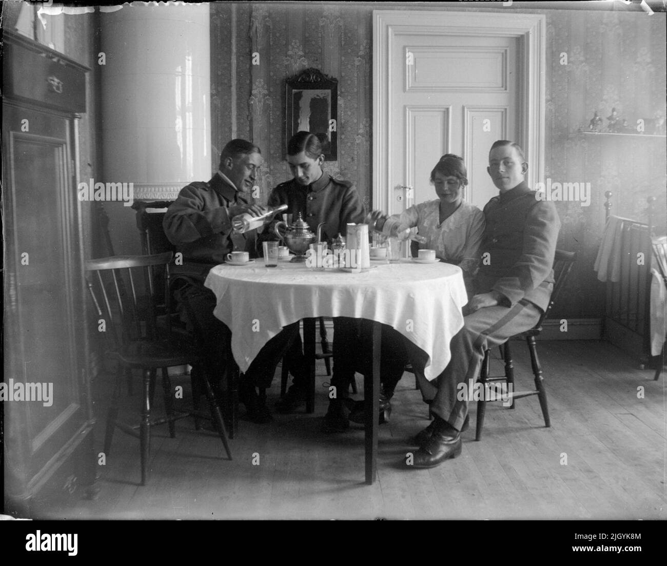 Group men seated table Black and White Stock Photos & Images - Alamy