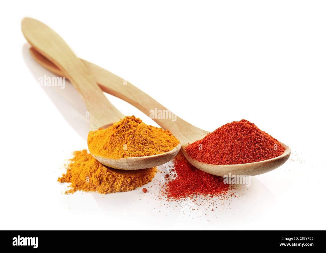 two spoons of spices isolated on white background Stock Photo - Alamy