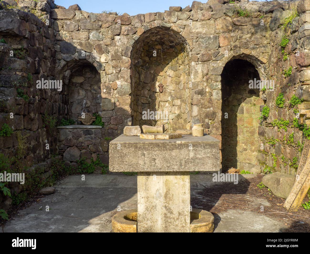 Ancient parts of the temple. Restoration work. Artifact. Part of an ...