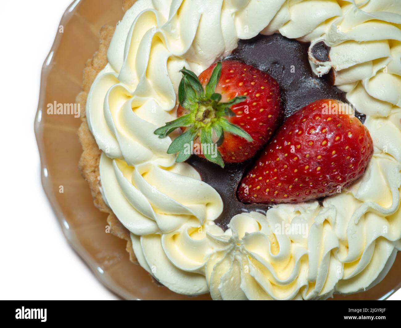 Cake with butter cream and strawberrie on the plates. Sweetness on a ...