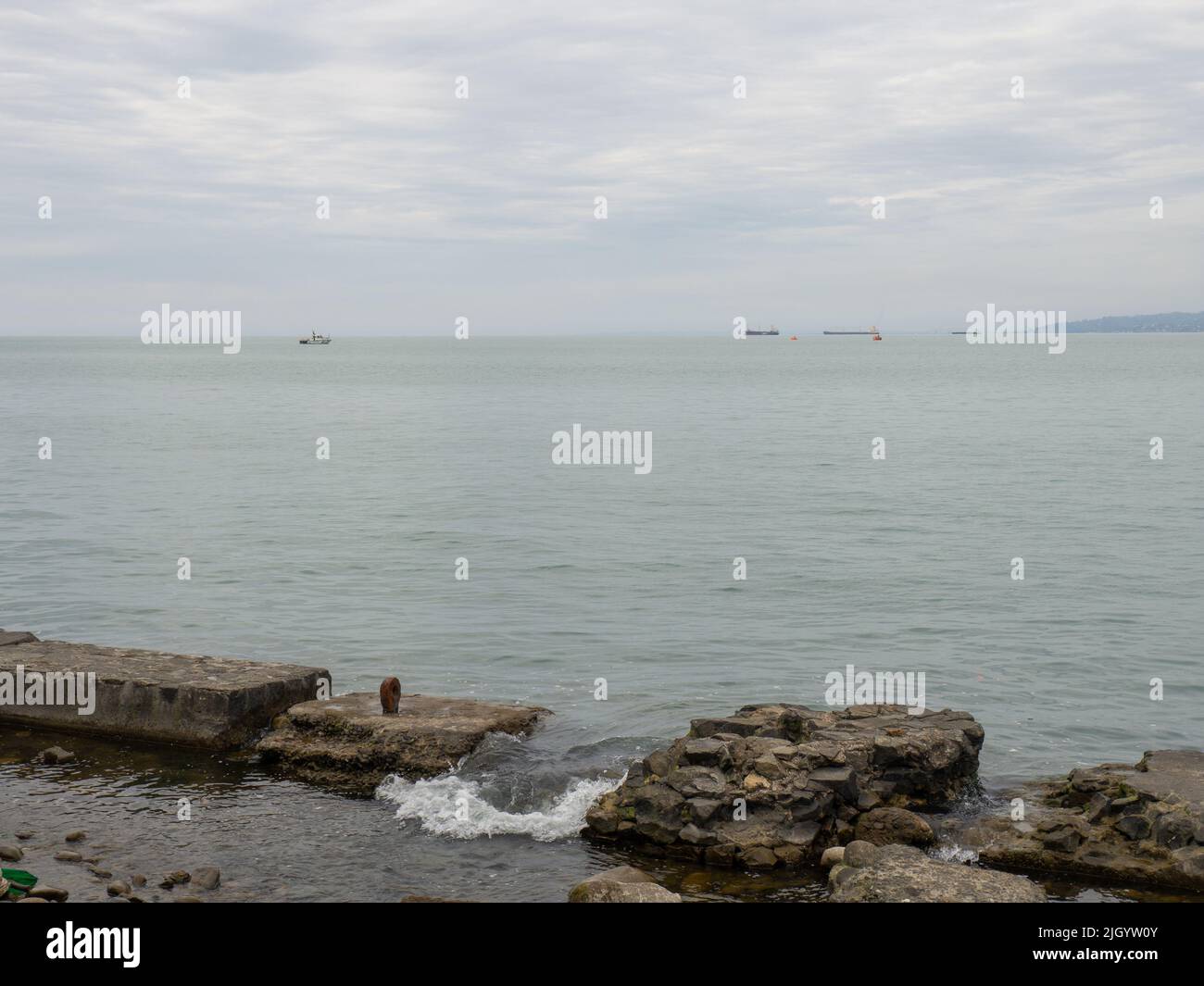 Stone pier. Mooring place for ships. Desert harbor. Loneliness. stone ...