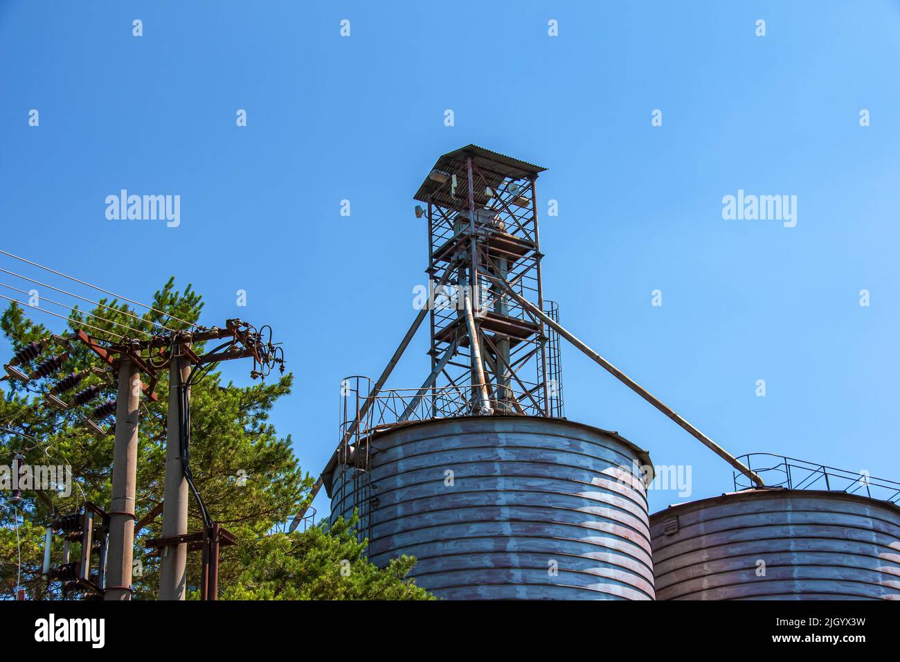 Agricultural industrial background. Large metal granaries in Slovakia ...