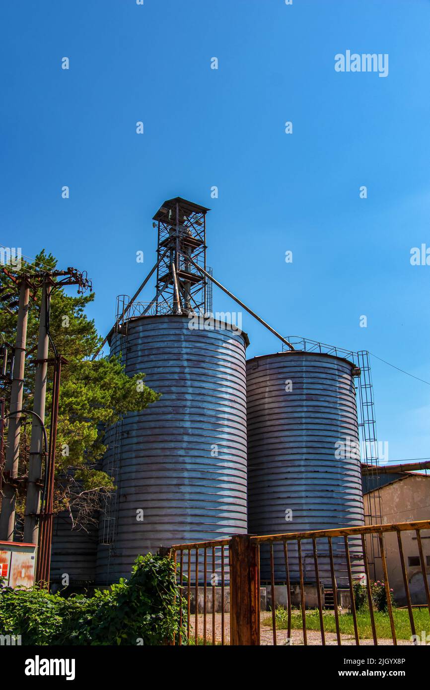 Agricultural industrial background. Large metal granaries in Slovakia ...