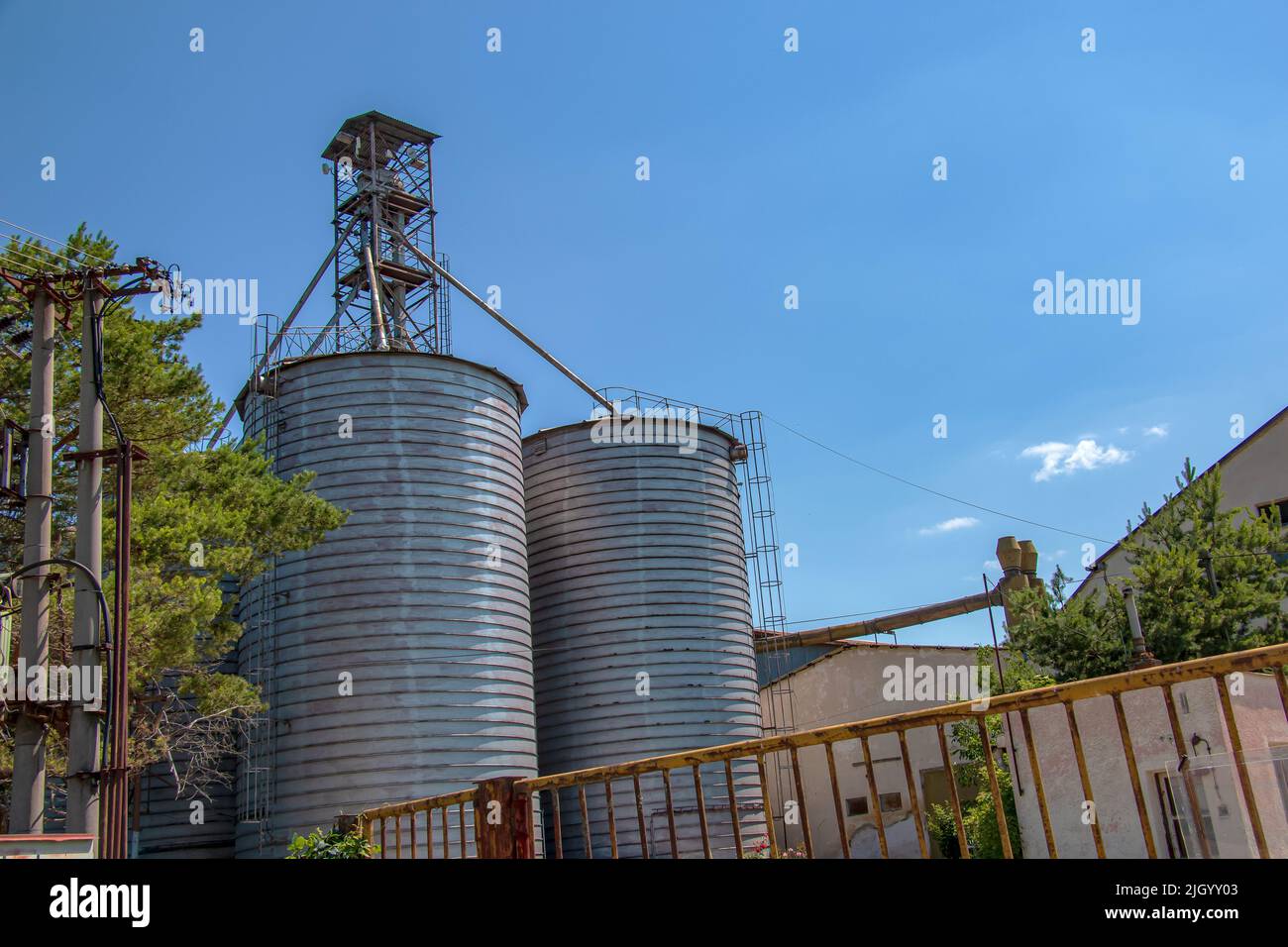 Agricultural industrial background. Large metal granaries in Slovakia ...