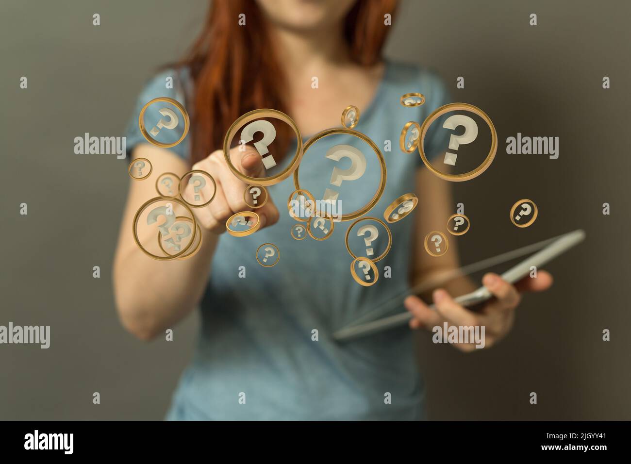 A person presenting a virtual projection of question marks Stock Photo ...