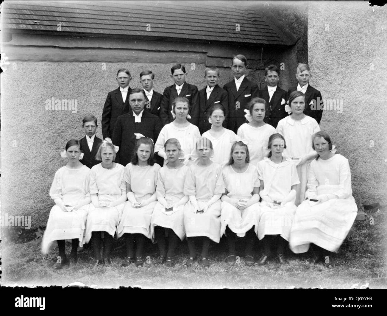 Confirmants and priest at Funbo church, Funbo parish, Uppland 1925 ...