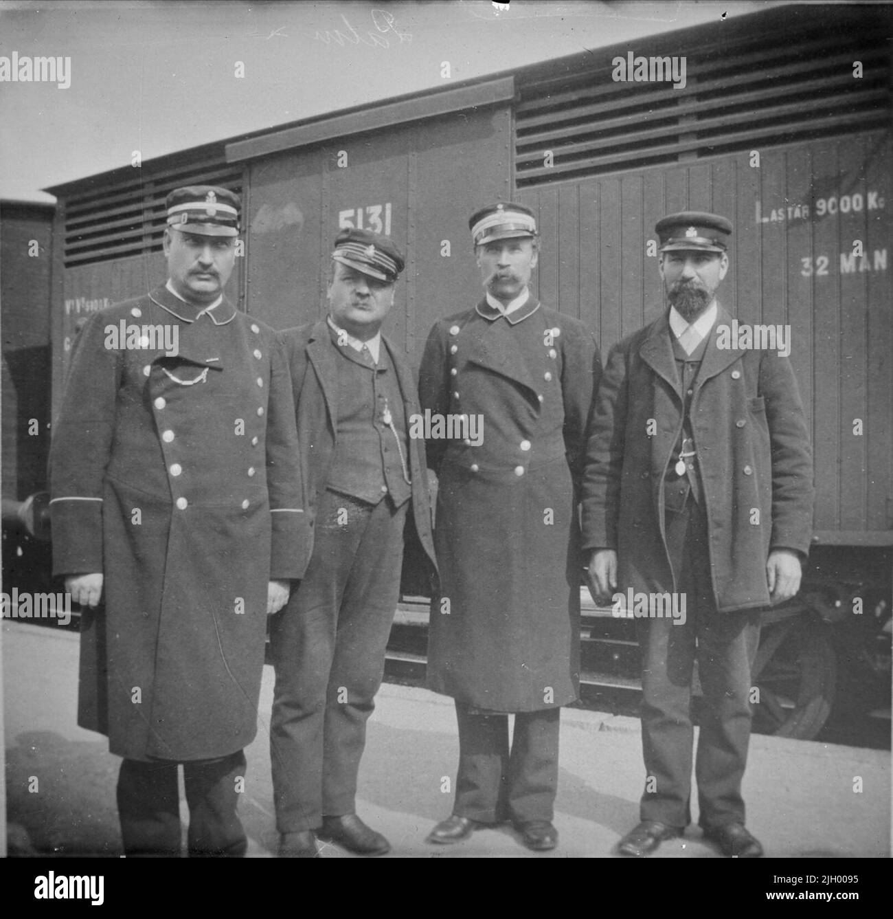 Group portrait - from left conductor, locomotive driver, superior ...