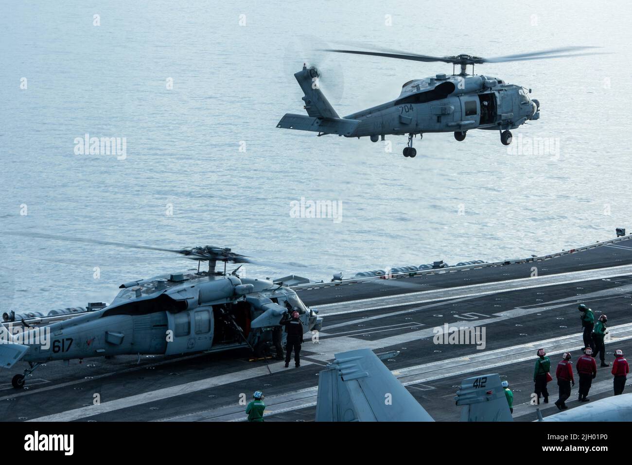 220711-N-UF592-1119 BASILAN STRAIT (July 11, 2022) An MH-60R Sea Hawk ...