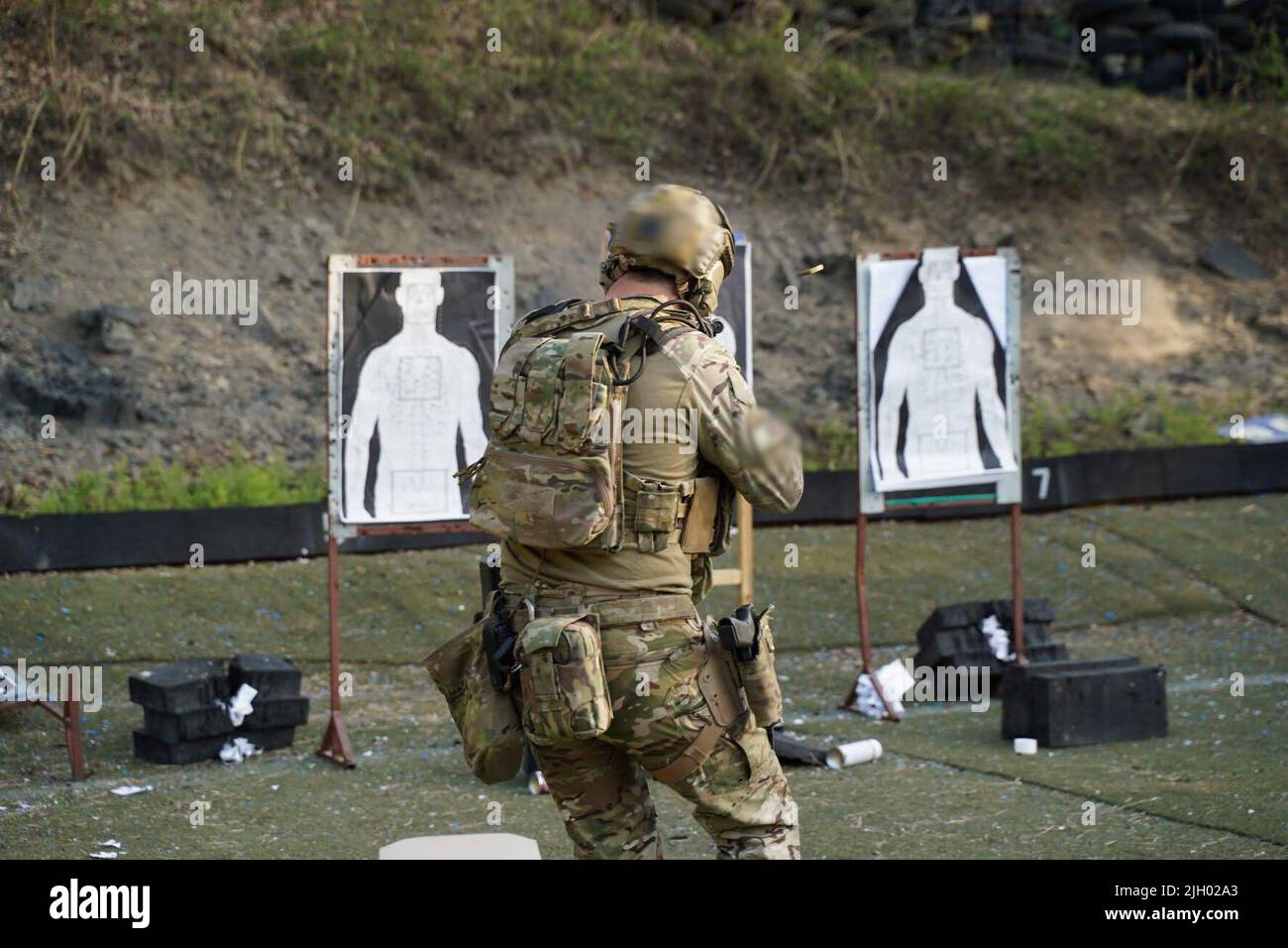 A Green Beret with 1st Special Forces Group (Airborne), fires at ...