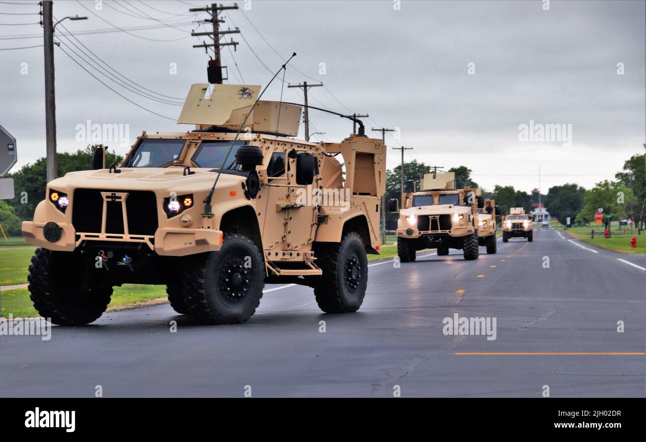 Service members drive Joint-Light Tactical Vehicles on the cantonment ...