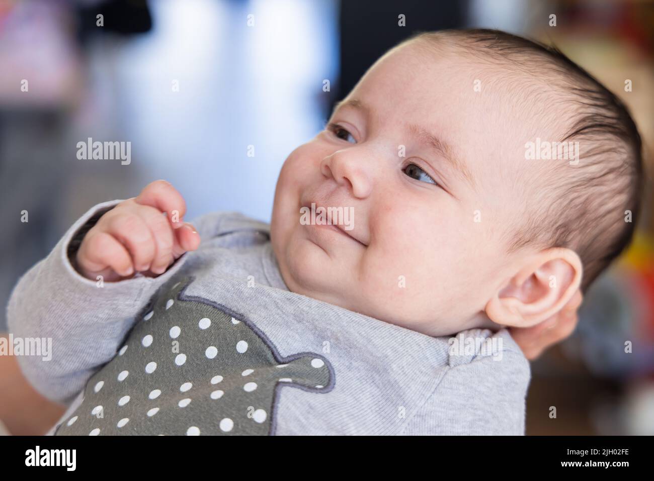 Cradling baby in arms hi-res stock photography and images - Alamy