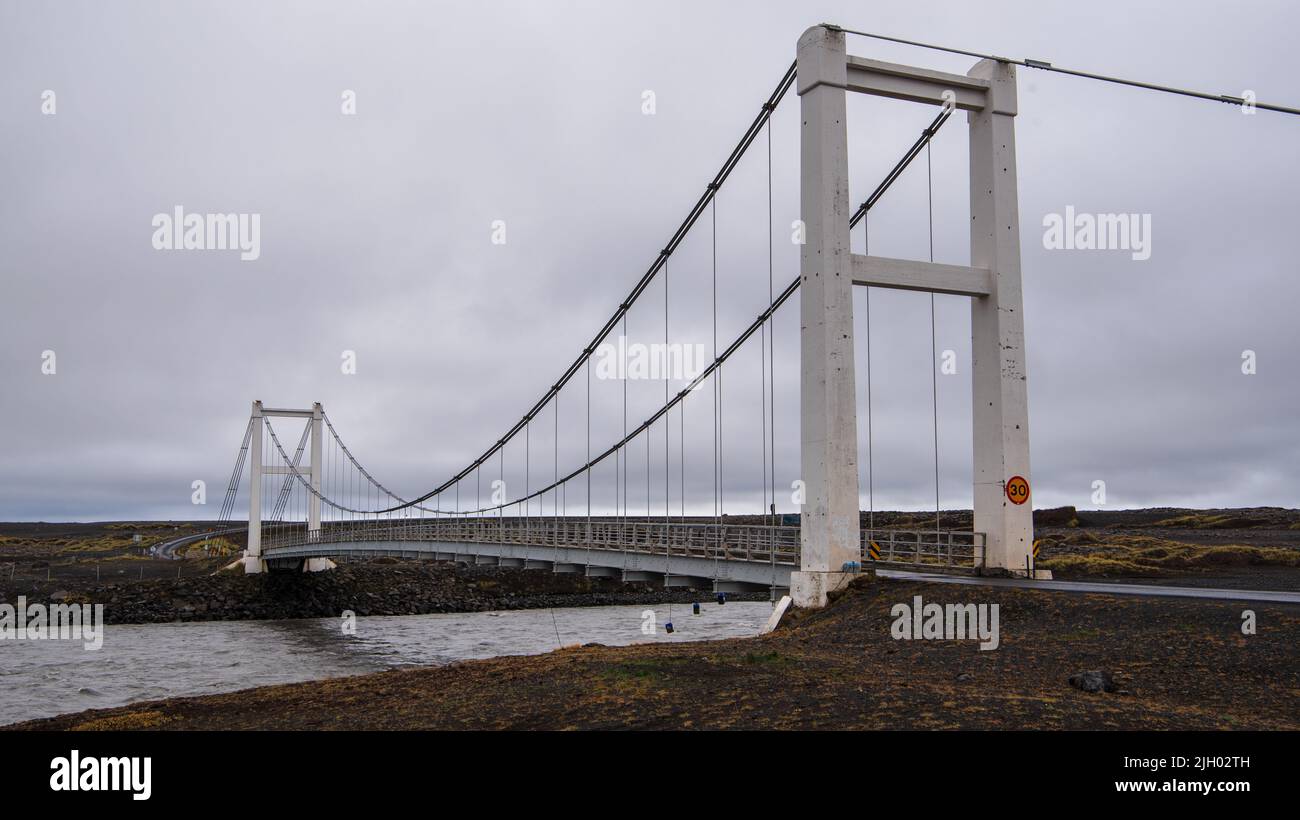 A simple single-lane bridge takes Route #1 across a glacier stream in ...