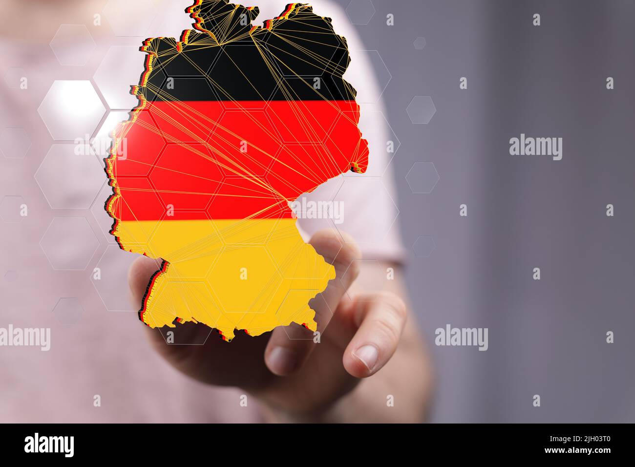 A person presenting a virtual projection of the map of Germany Stock ...