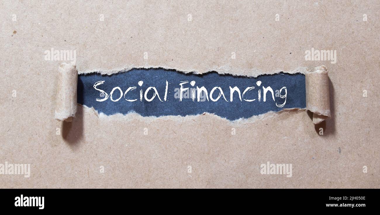 Card with text SOCIAL FINANCING on white background, near office ...