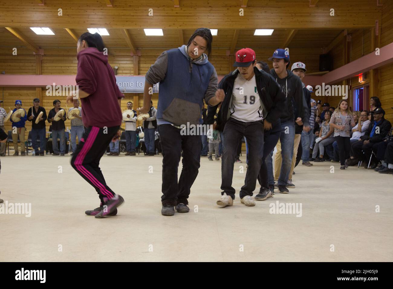 Indigenous Dene youth dancing in drum dance, in the northern Indigenous ...