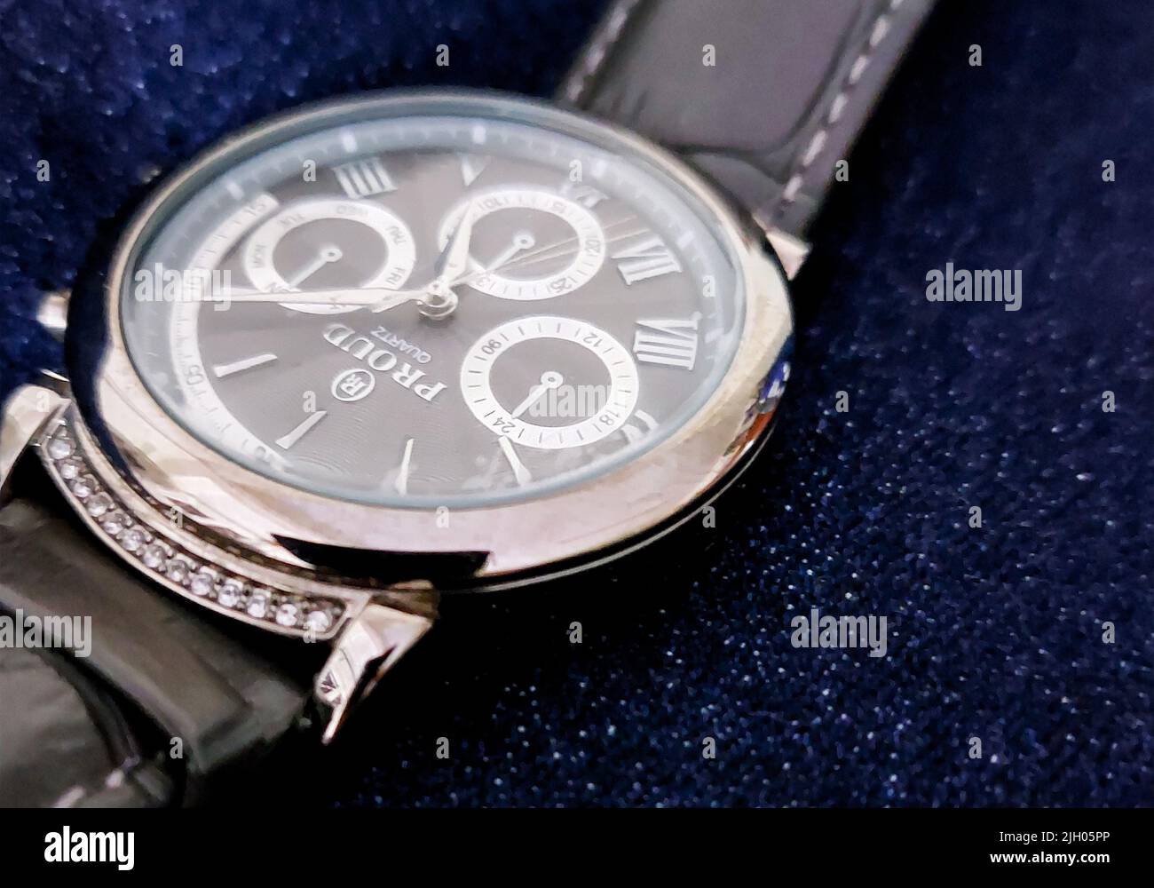 Nice luxury man's wrist watch on dark background. Stainless steel man's ...