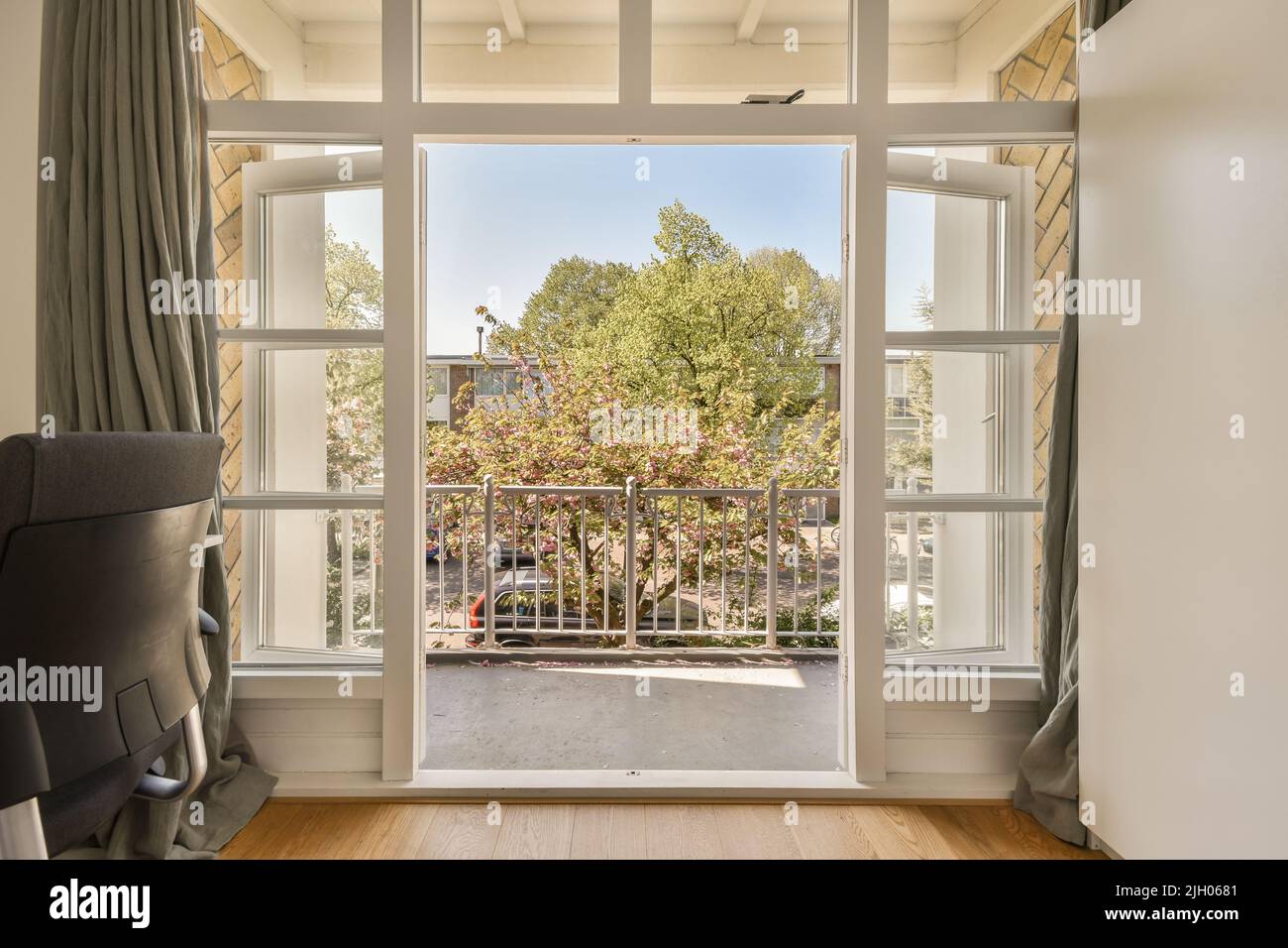 Front view of vegetation from small balcony with railings Stock Photo ...