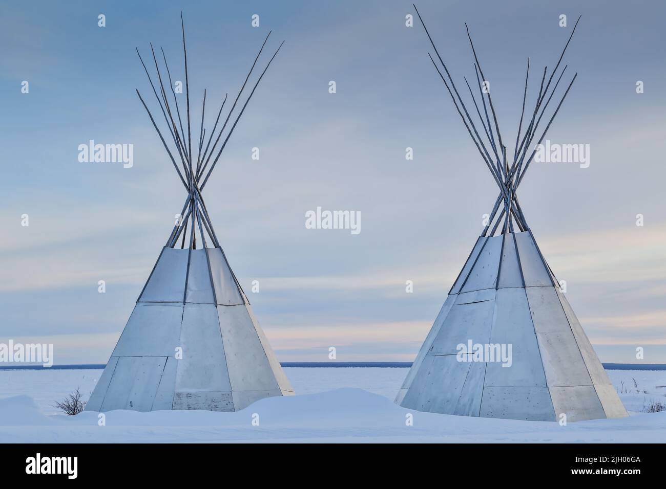 Two teepees in winter in the northern Indigenous community of Deline ...