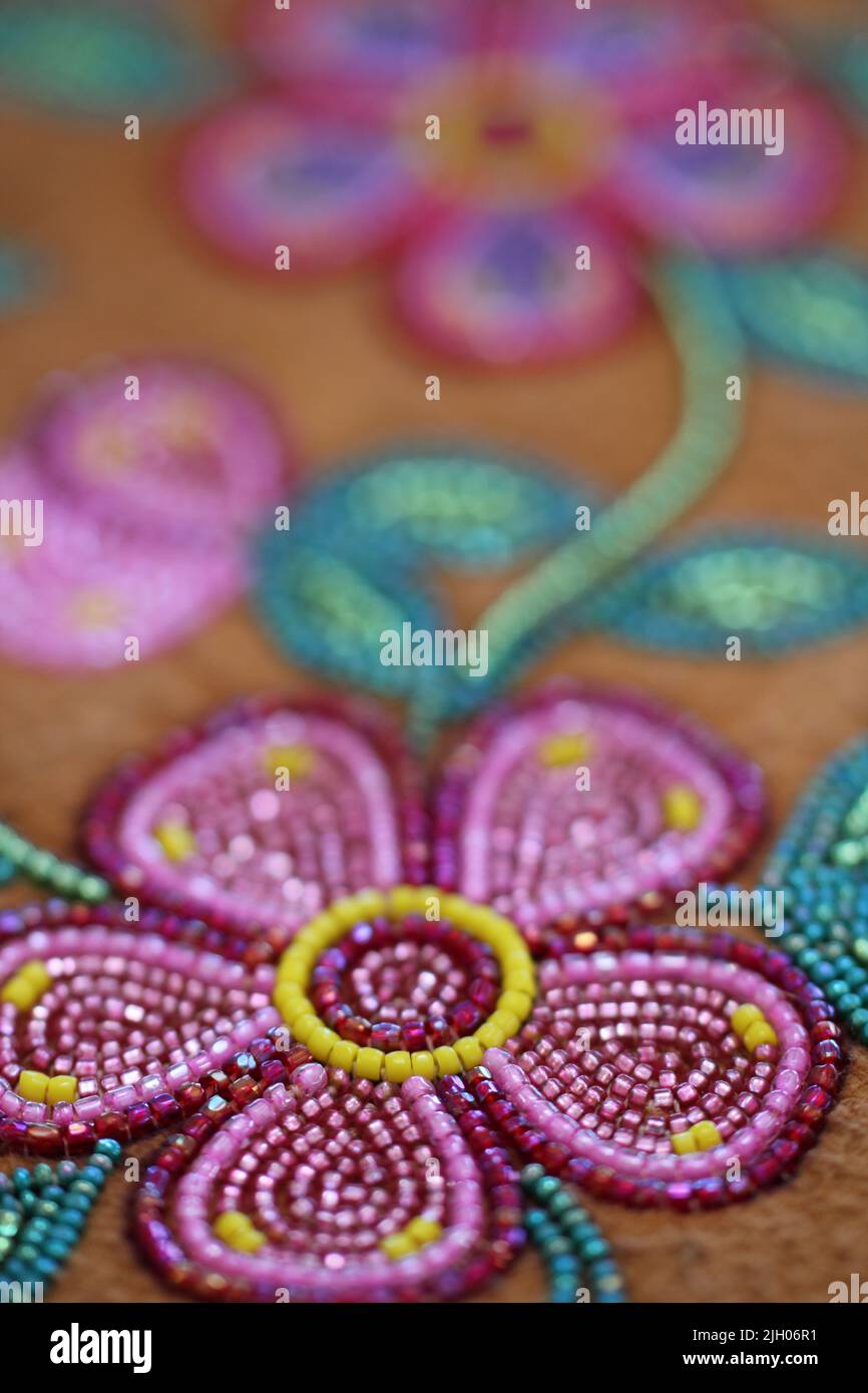 Macro shot of Dene beaded flower on moosehide, made in the northern ...