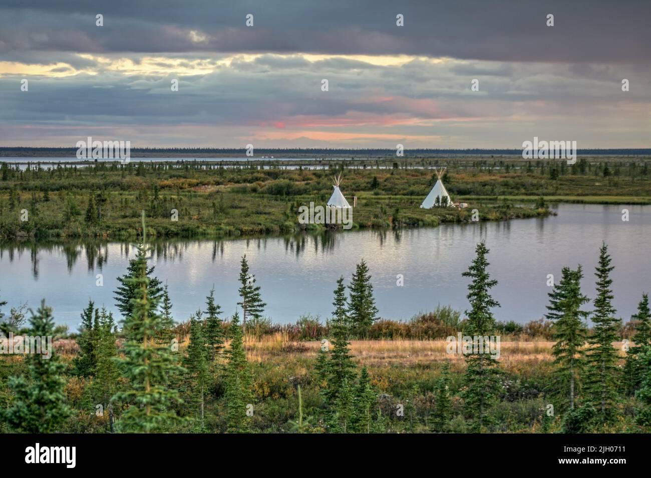 Two teepees in the distance, in the northern Indigenous community of ...