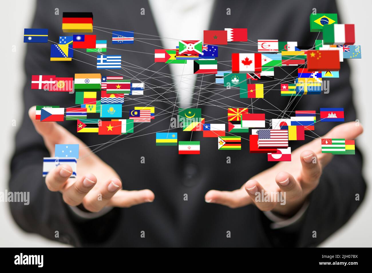 A 3D rendering of the world's national flags on a blurry background ...