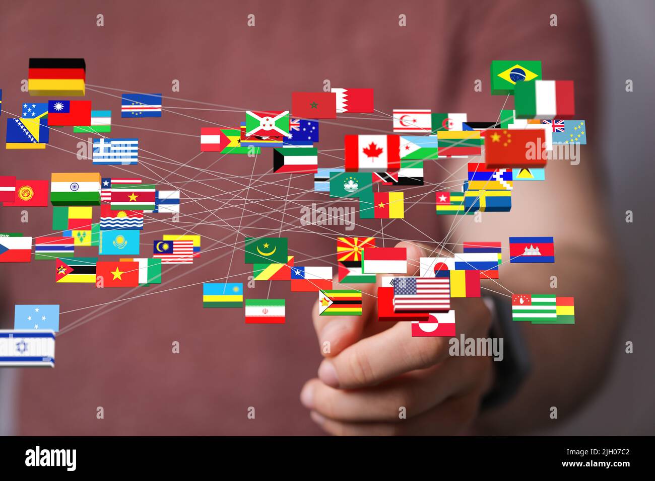 A 3D rendering of the world's national flags on a blurry background ...