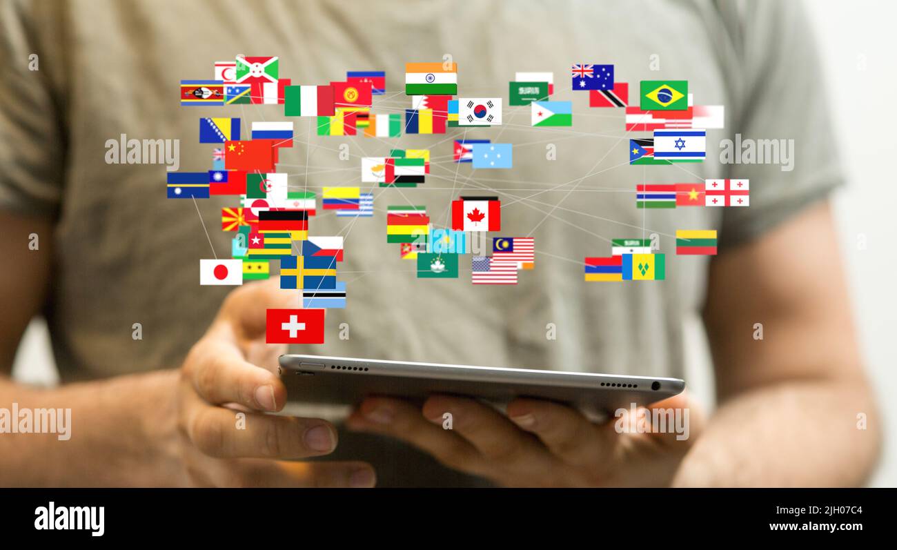 A 3D rendering of the world's national flags on a blurry background ...