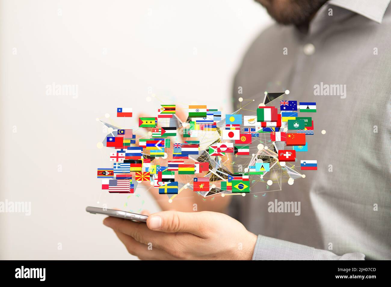 A 3D rendering of the world's national flags on a blurry background ...