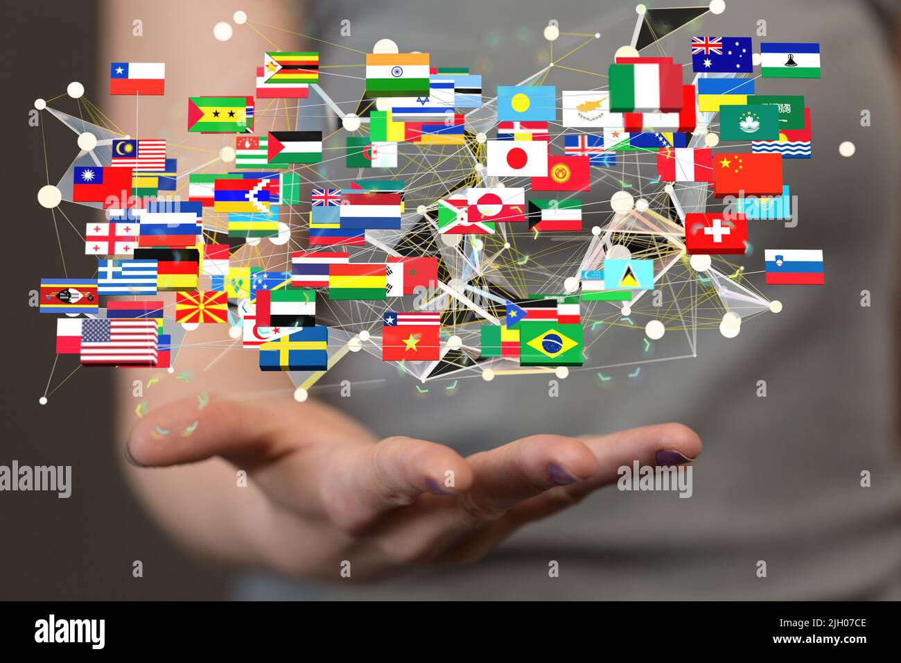 A 3D rendering of the world's national flags on a blurry background ...