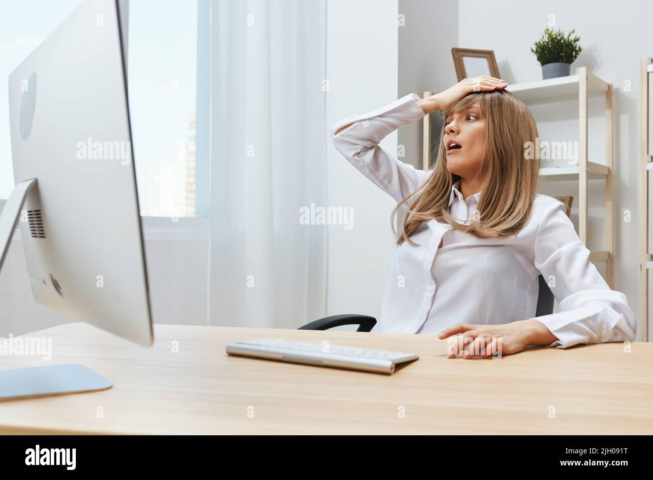Shocked adorable blonde businesswoman worker touch head have headache ...