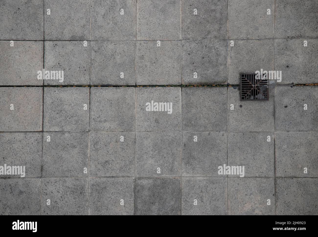 Granite mosaic floor. Construction materials storm drain grate Stock ...