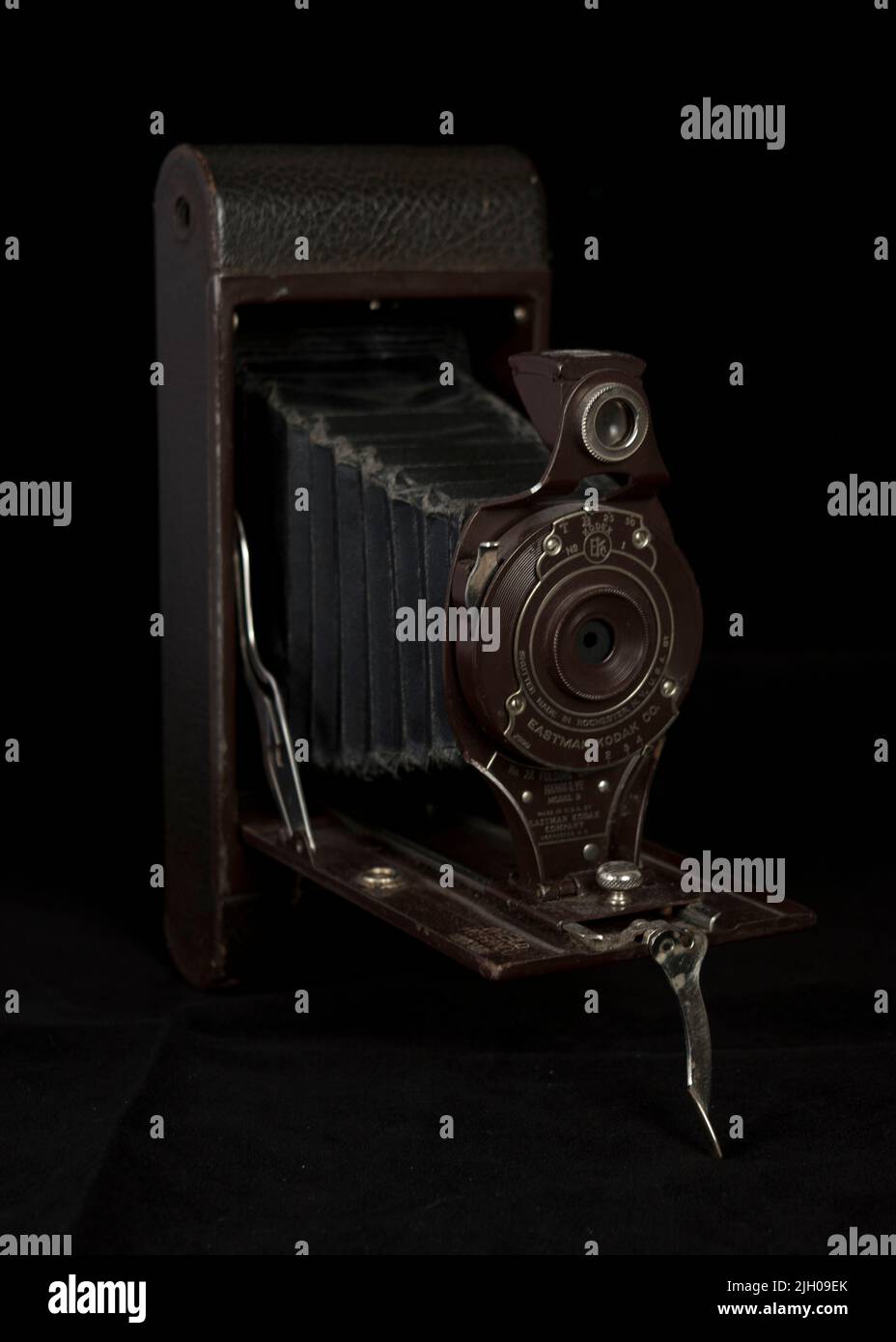 old bellows photographic camera on black background Stock Photo - Alamy