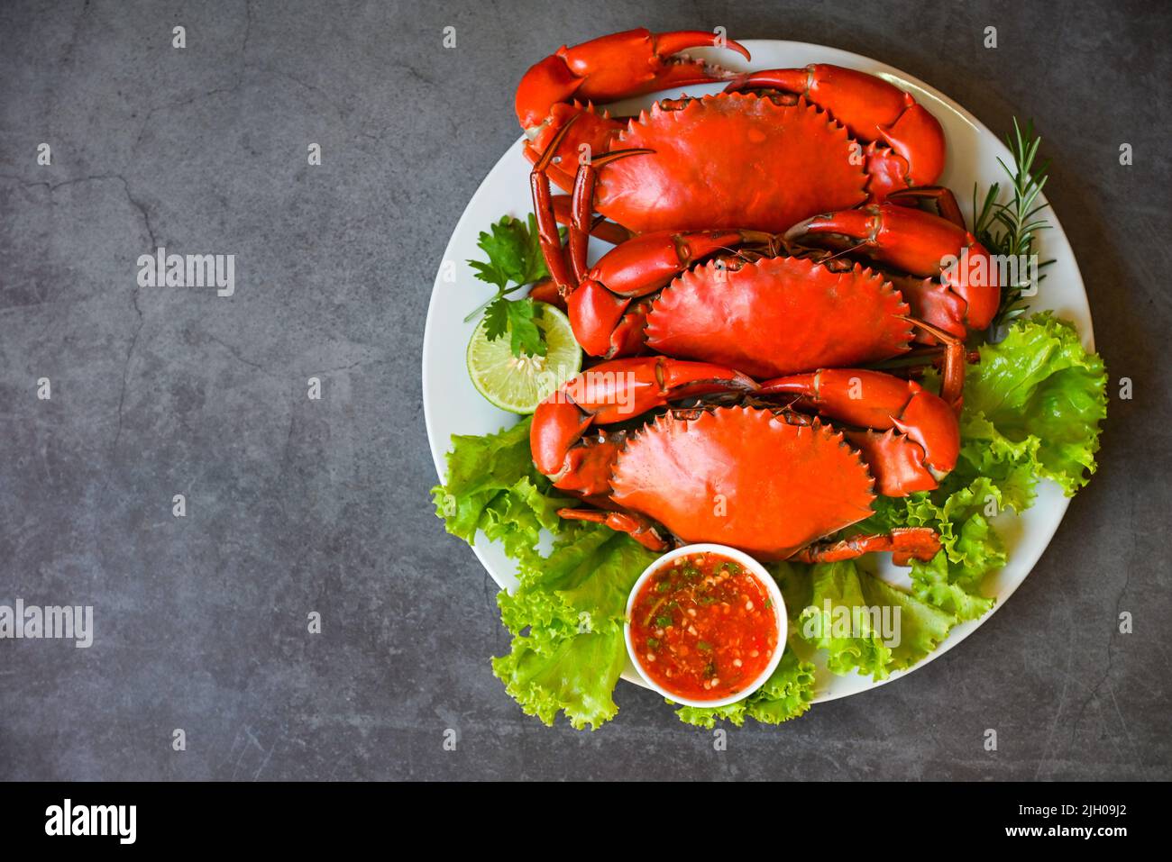 fresh crab on white plate and seafood sauce, crab cooking food boiled ...