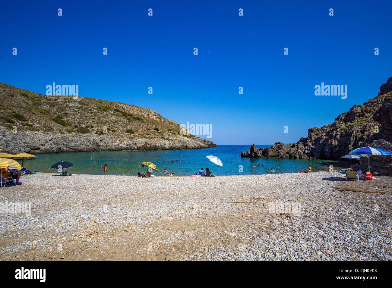 The beautiful pebbled beach of Chalkos in Kythera. Amazing scenery with ...