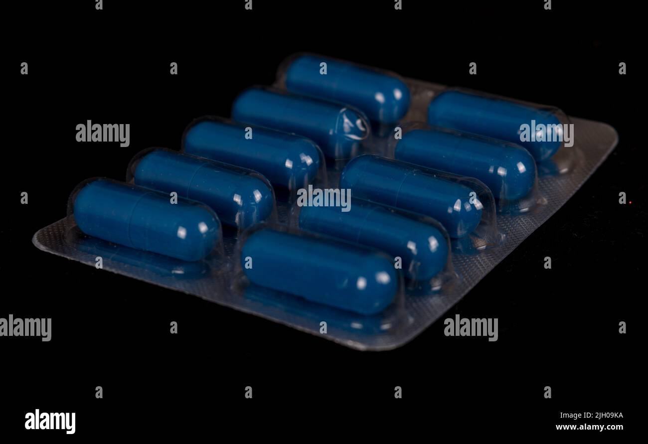 Blister of blue pills for medicine Stock Photo - Alamy