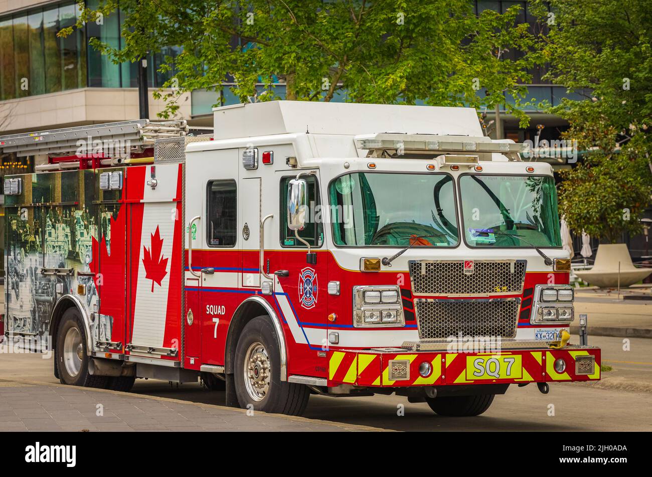 Firetruck driving on a road. Vancouver Fire Engine. Fire rescue vehicle ...