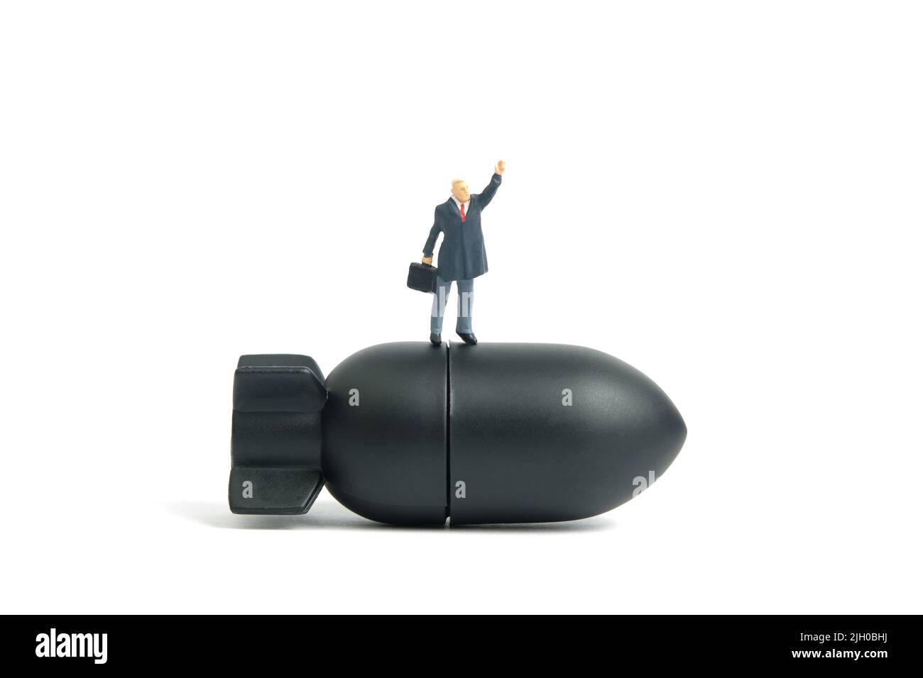 Miniature people toy figure photography. A businessman standing above ...