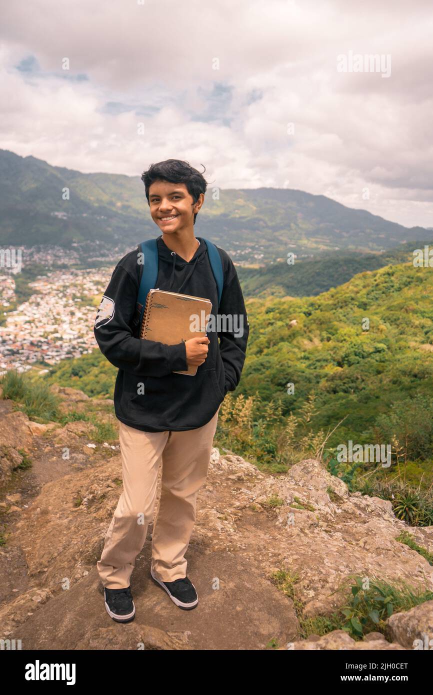 Vertical photo of Latin college freshman smiling and looking at camera ...