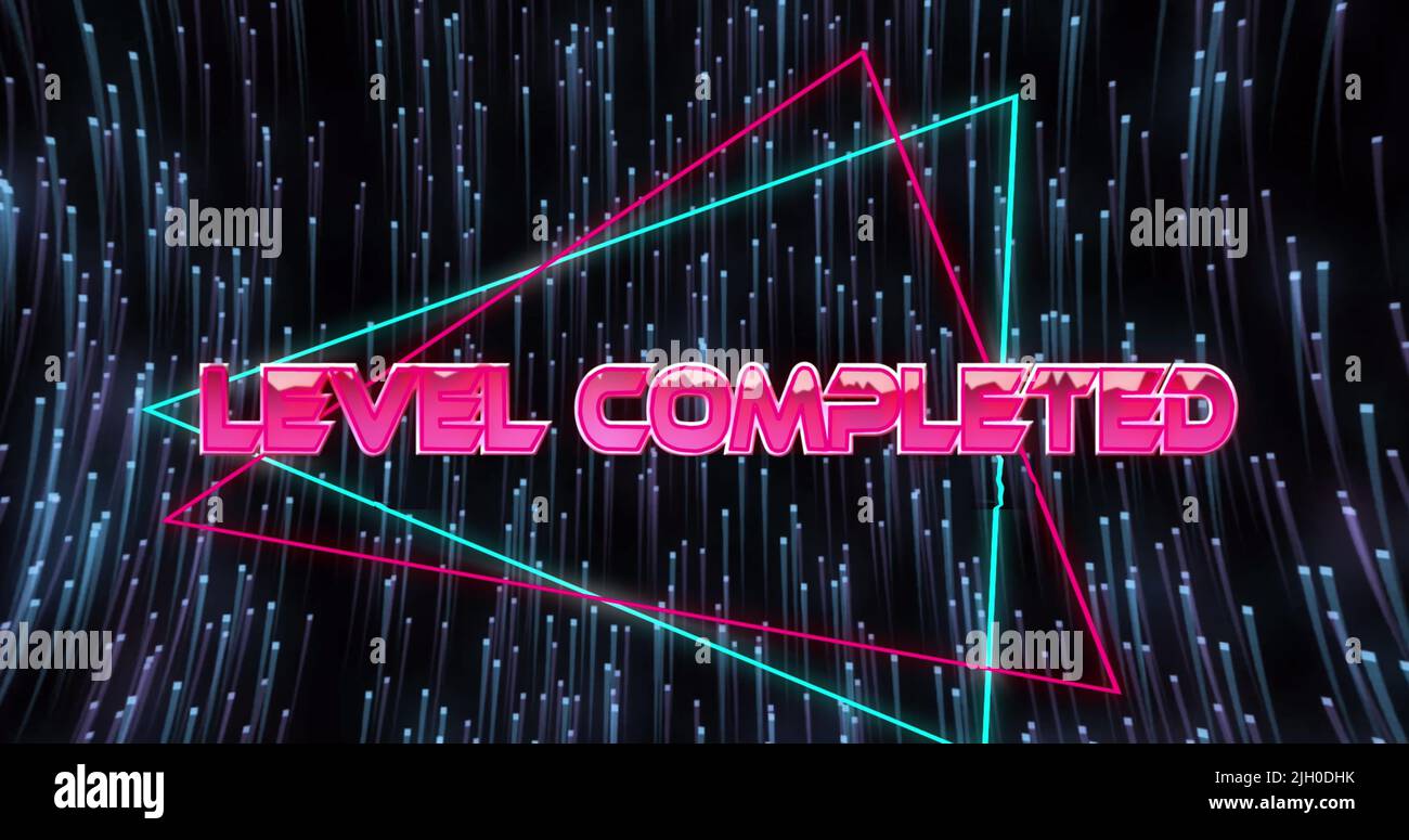 Image of level completed text over light trails on black background ...