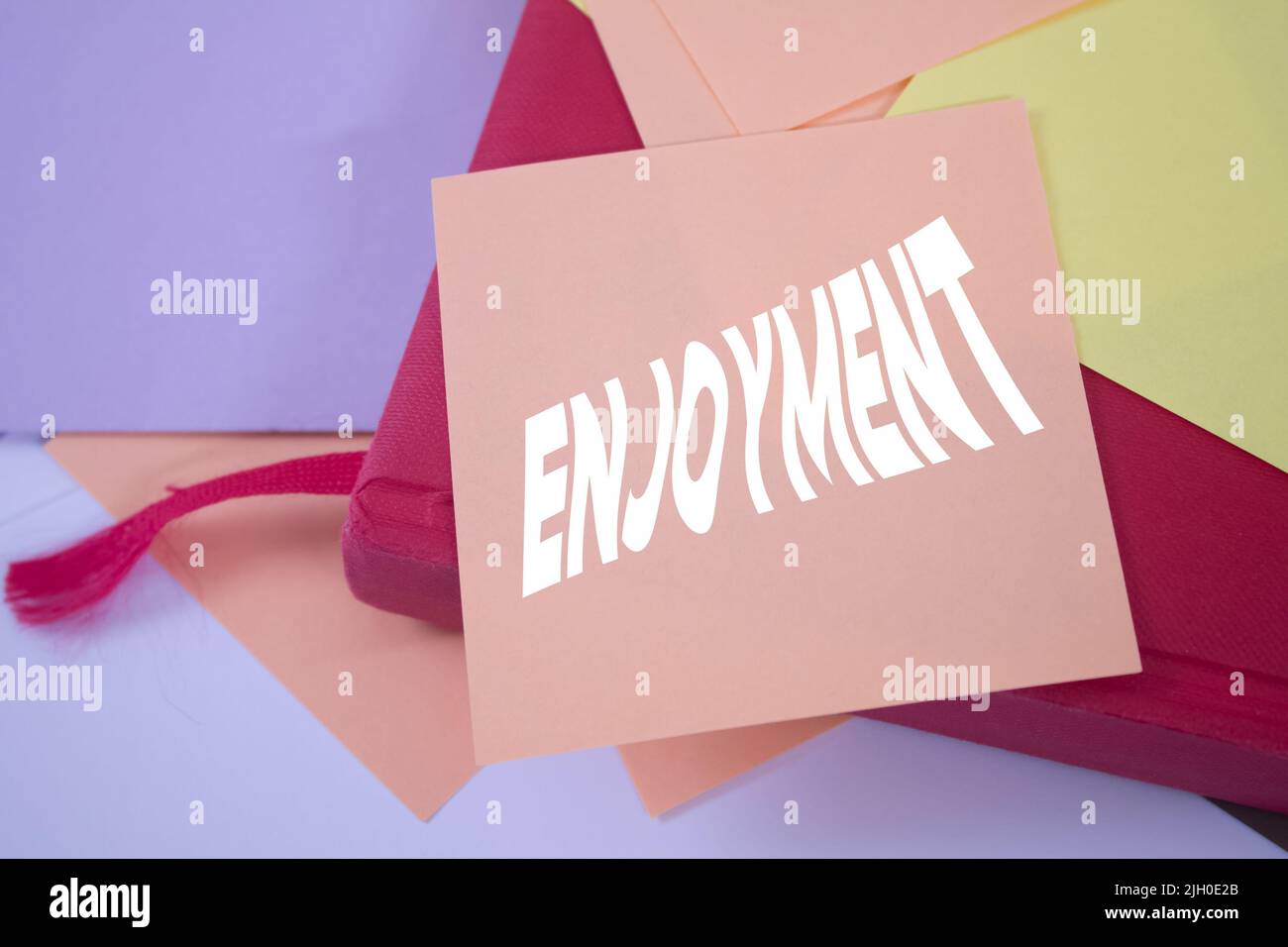 Enjoyment. Text on adhesive note paper. Event, celebration reminder ...