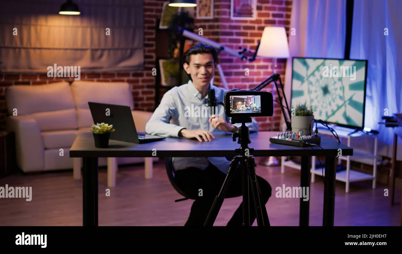 Asian vlogger recording online video for podcast show, filming episode ...
