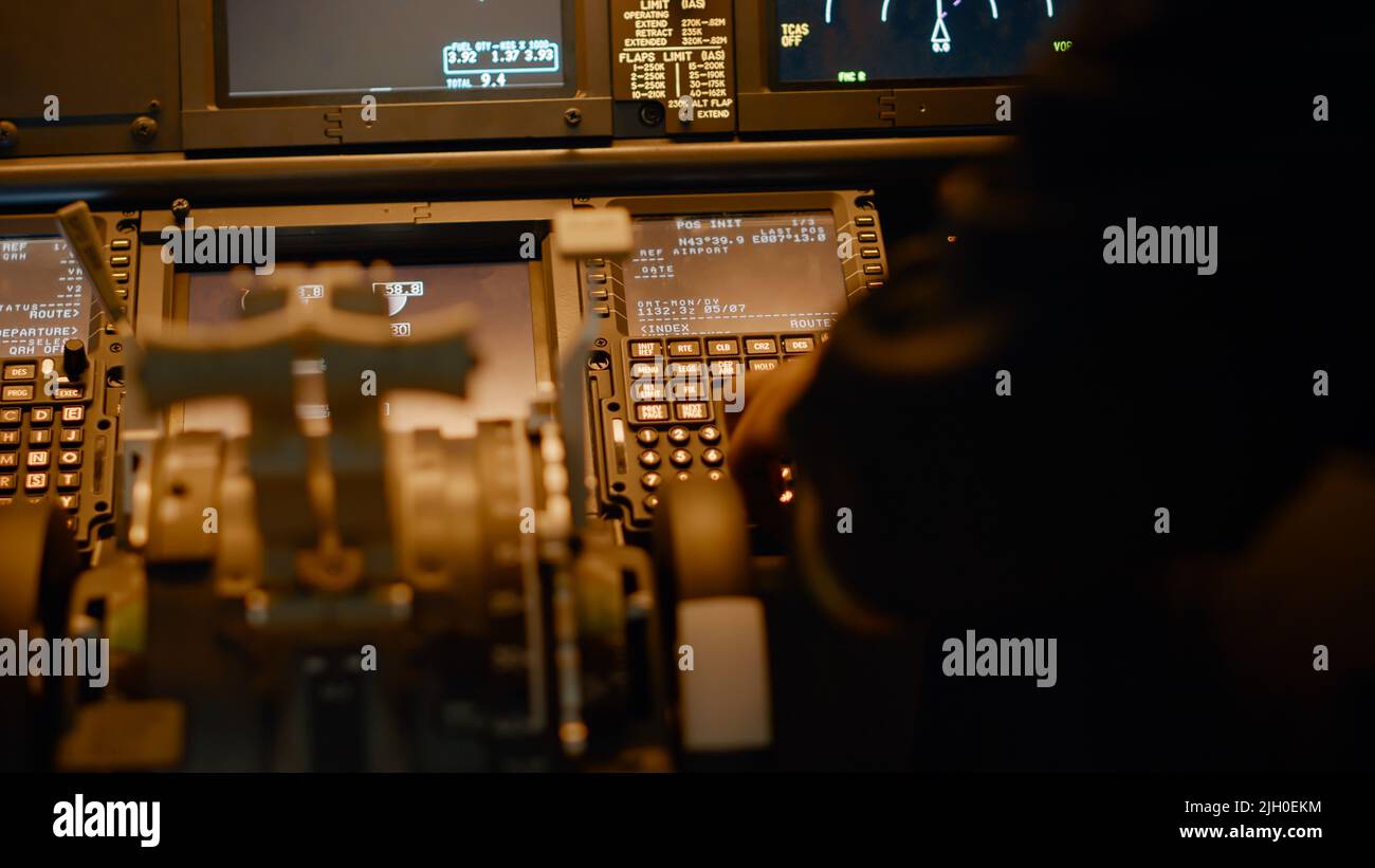 Male Copilot Inserting Flight Coordinates To Arrive At Destination Using Dashboard Command For